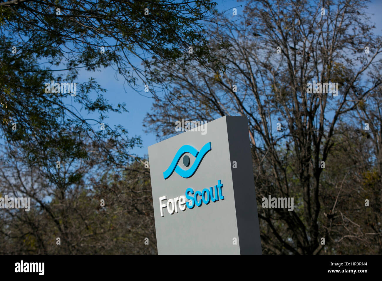 A logo sign outside of a facility occupied by ForeScout Technologies ...