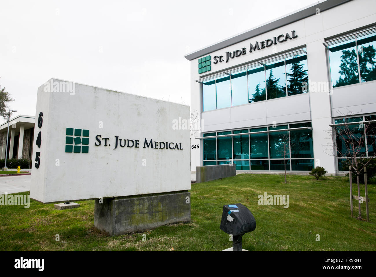 A logo sign outside of a facility occupied by St. Jude Medical, Inc ...