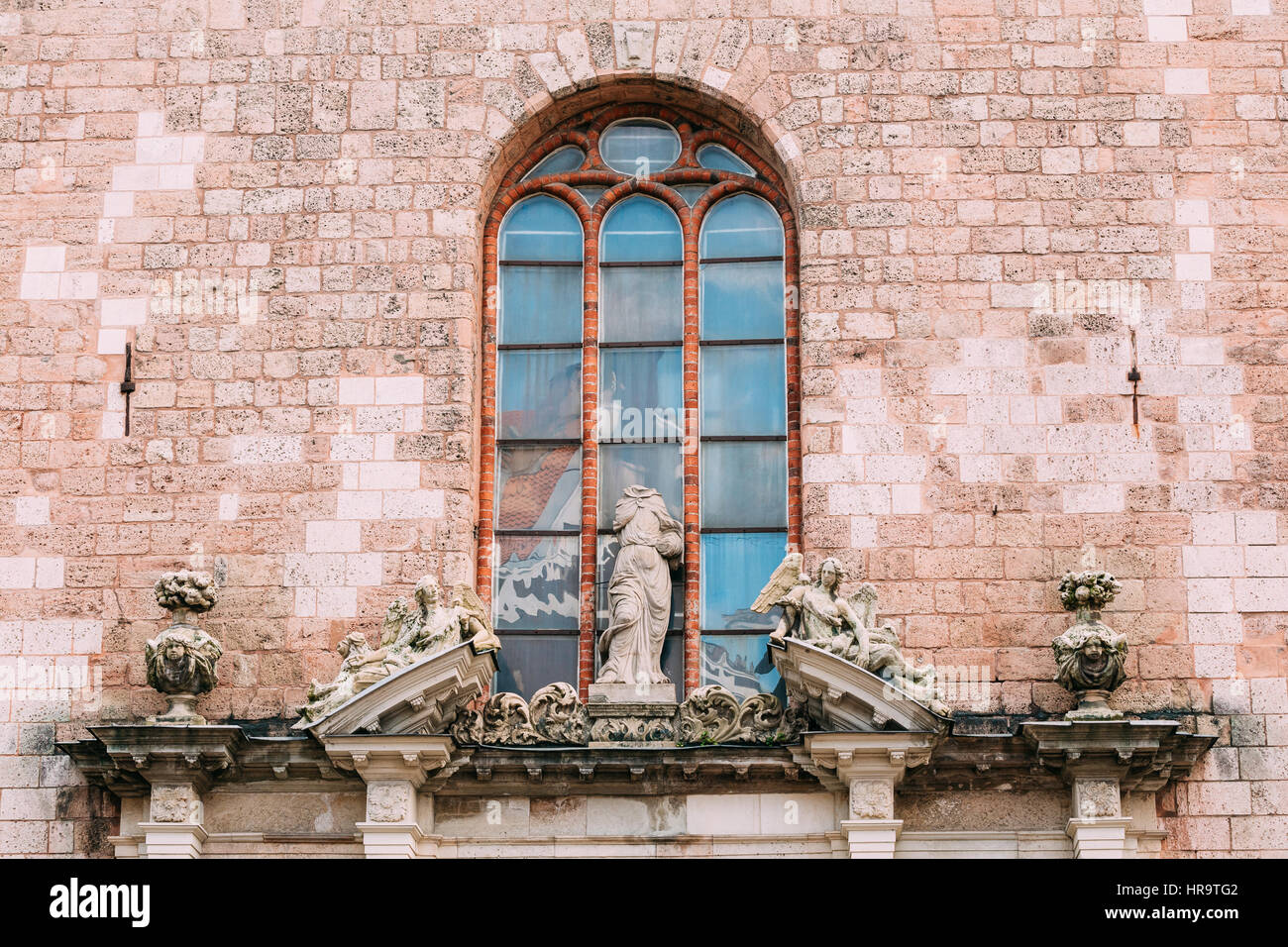 Riga, Latvia. Three Ancient Statues In Baroque Style On Top Of Portal ...