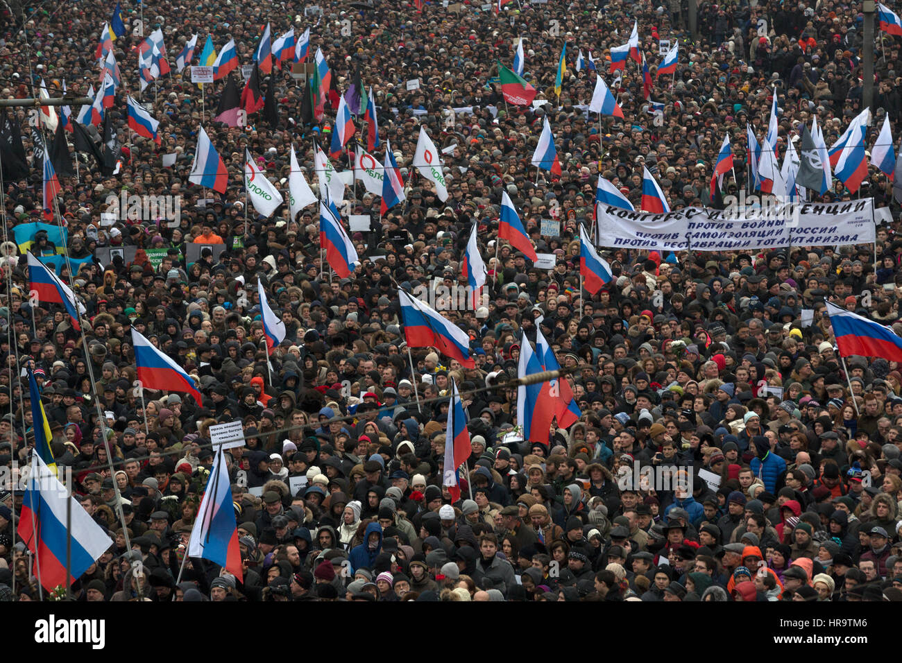 Aerial view of thousands of people attend a political rally in central ...