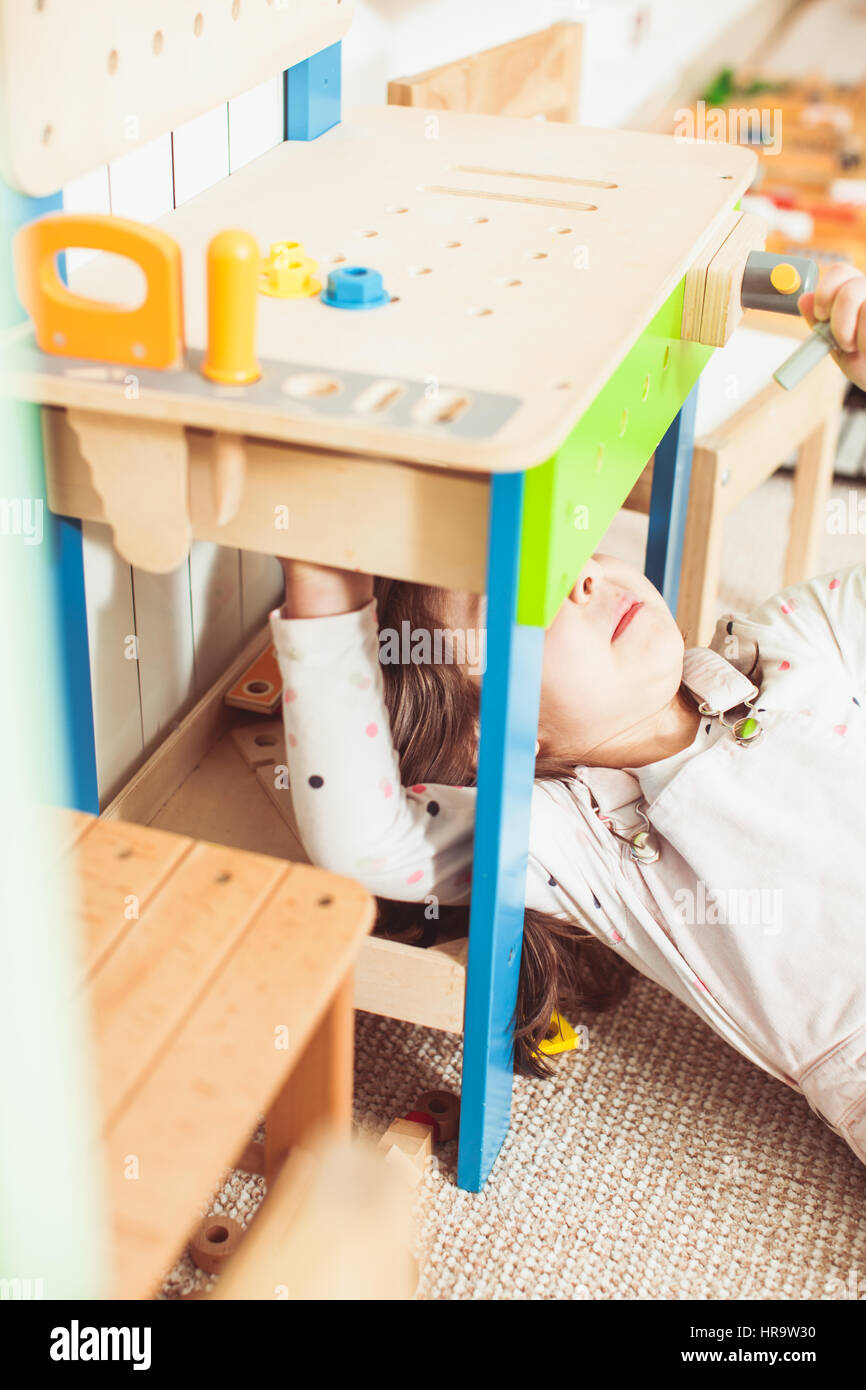 Girl enjoys tinkering Stock Photo - Alamy