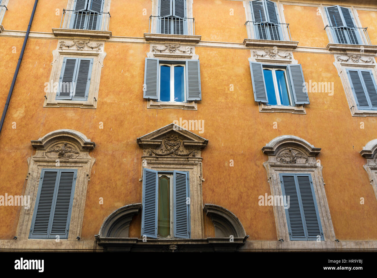Facade of classical building with windows open and closed in the ...
