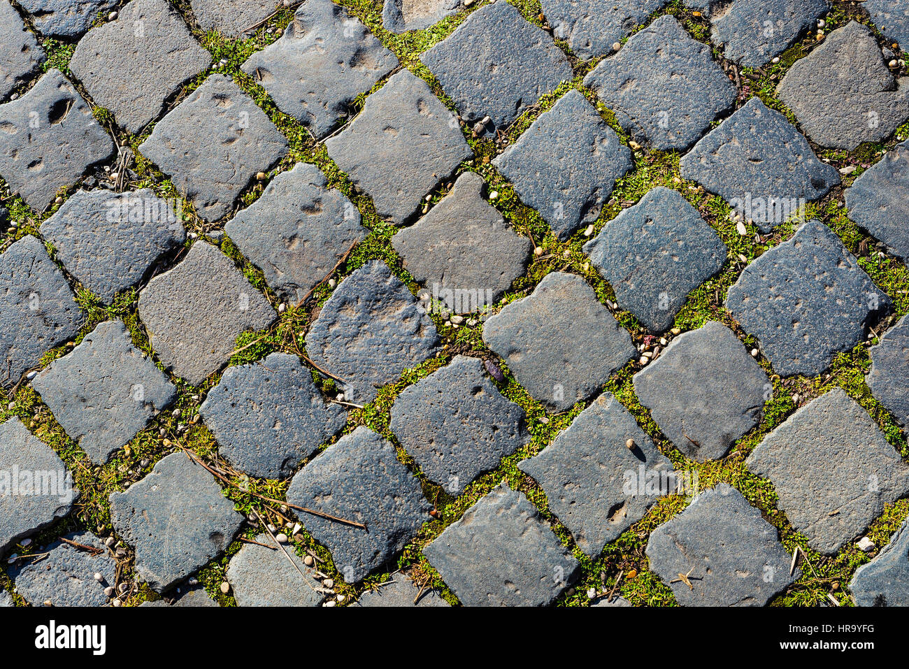 Closeup of a roman stone walkway in Rome, Italy Stock Photo - Alamy