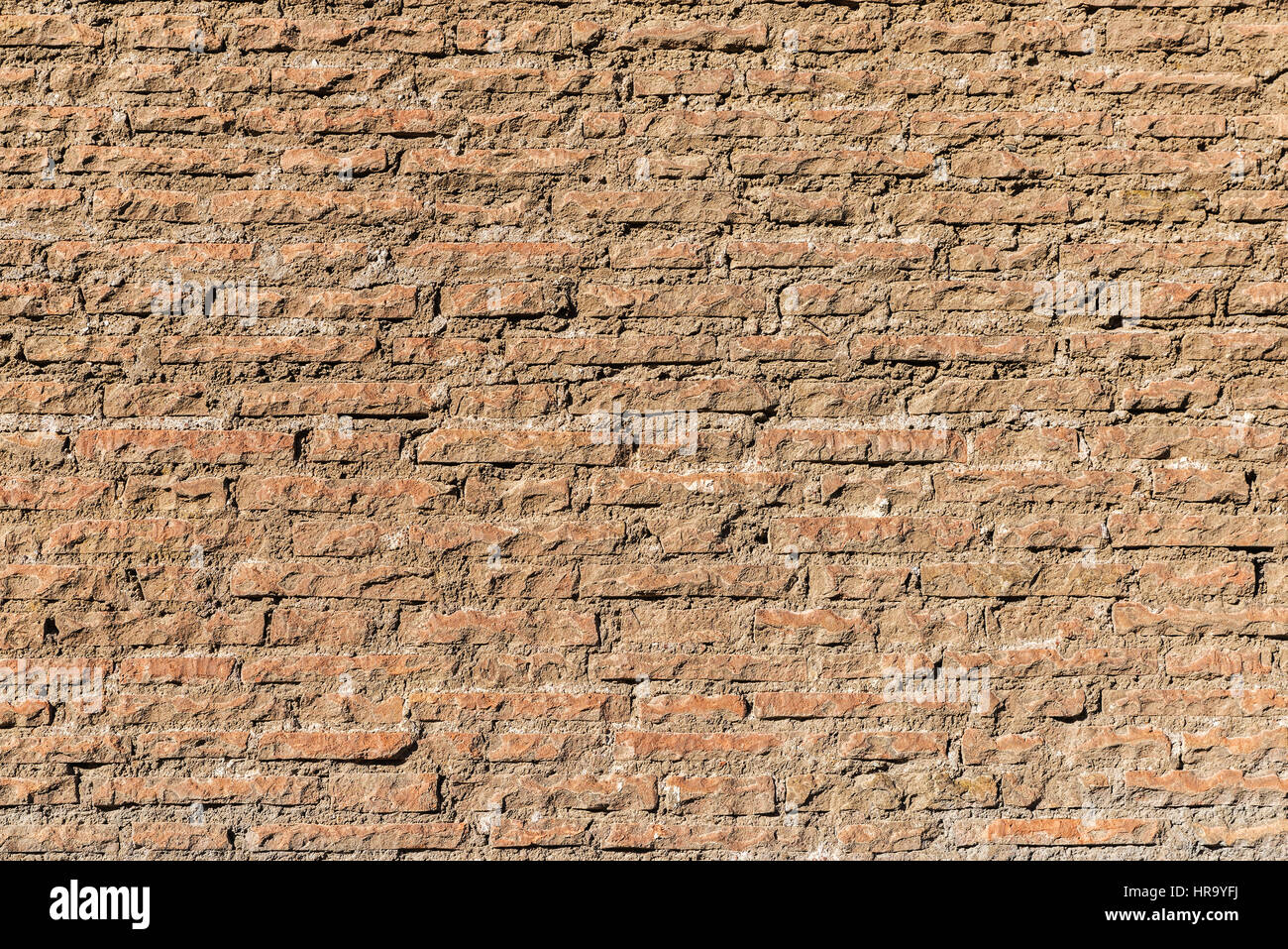 Wall of old bricks as background of a roman building in Rome, Italy ...