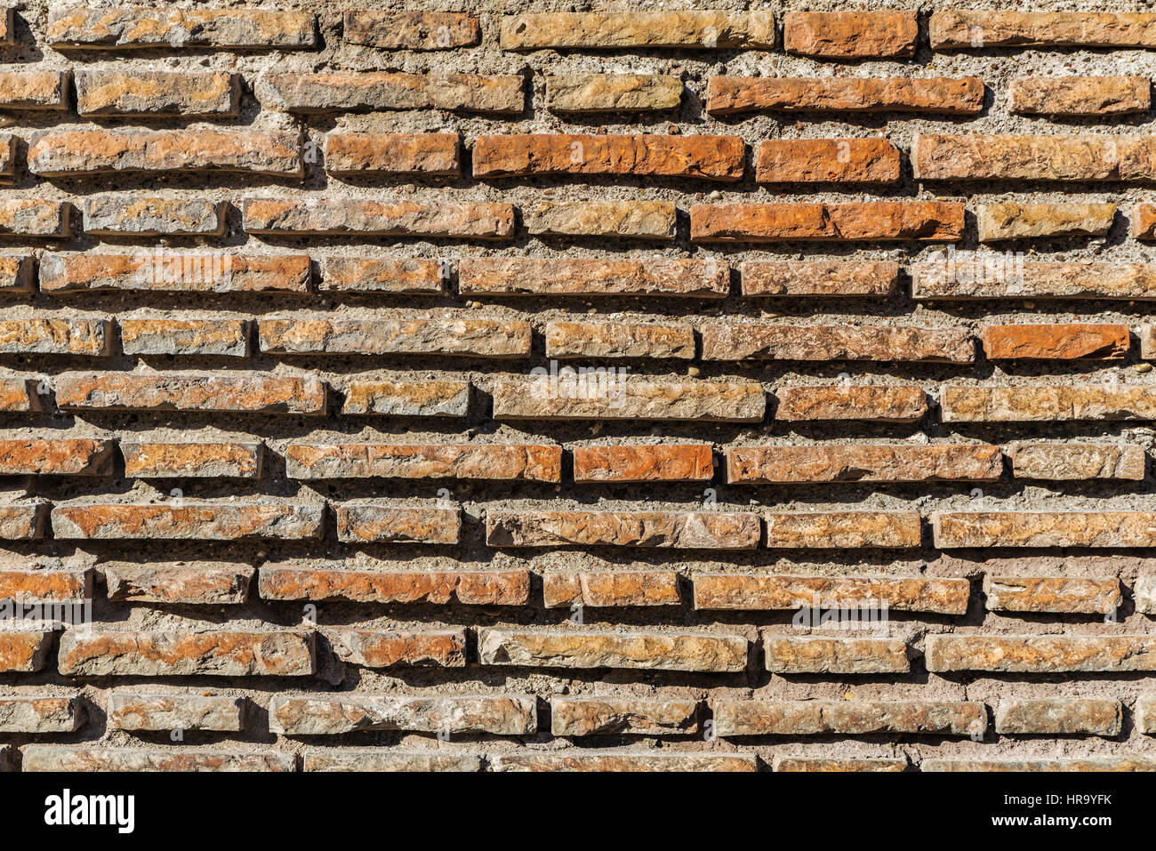 Wall of old bricks as background of a roman building in Rome, Italy ...