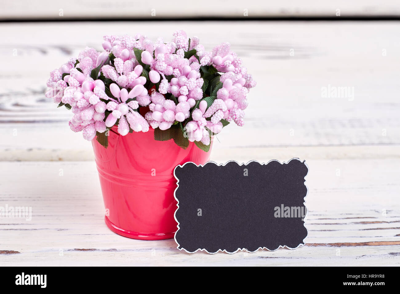 Bucket with flowers and card Stock Photo - Alamy