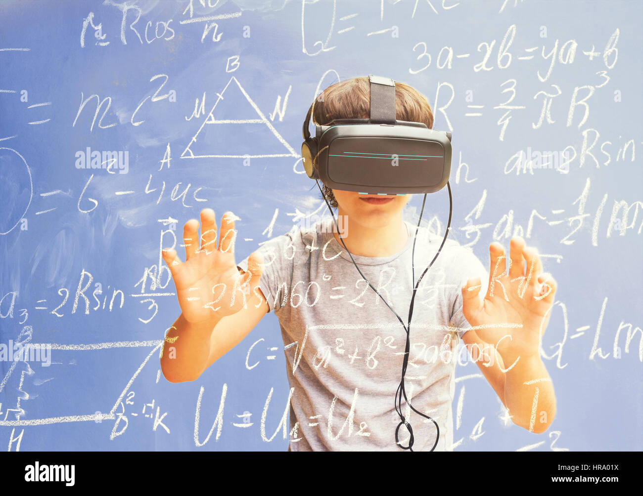 Teenager wearing VR virtual realty glasses and learning math - virtual ...