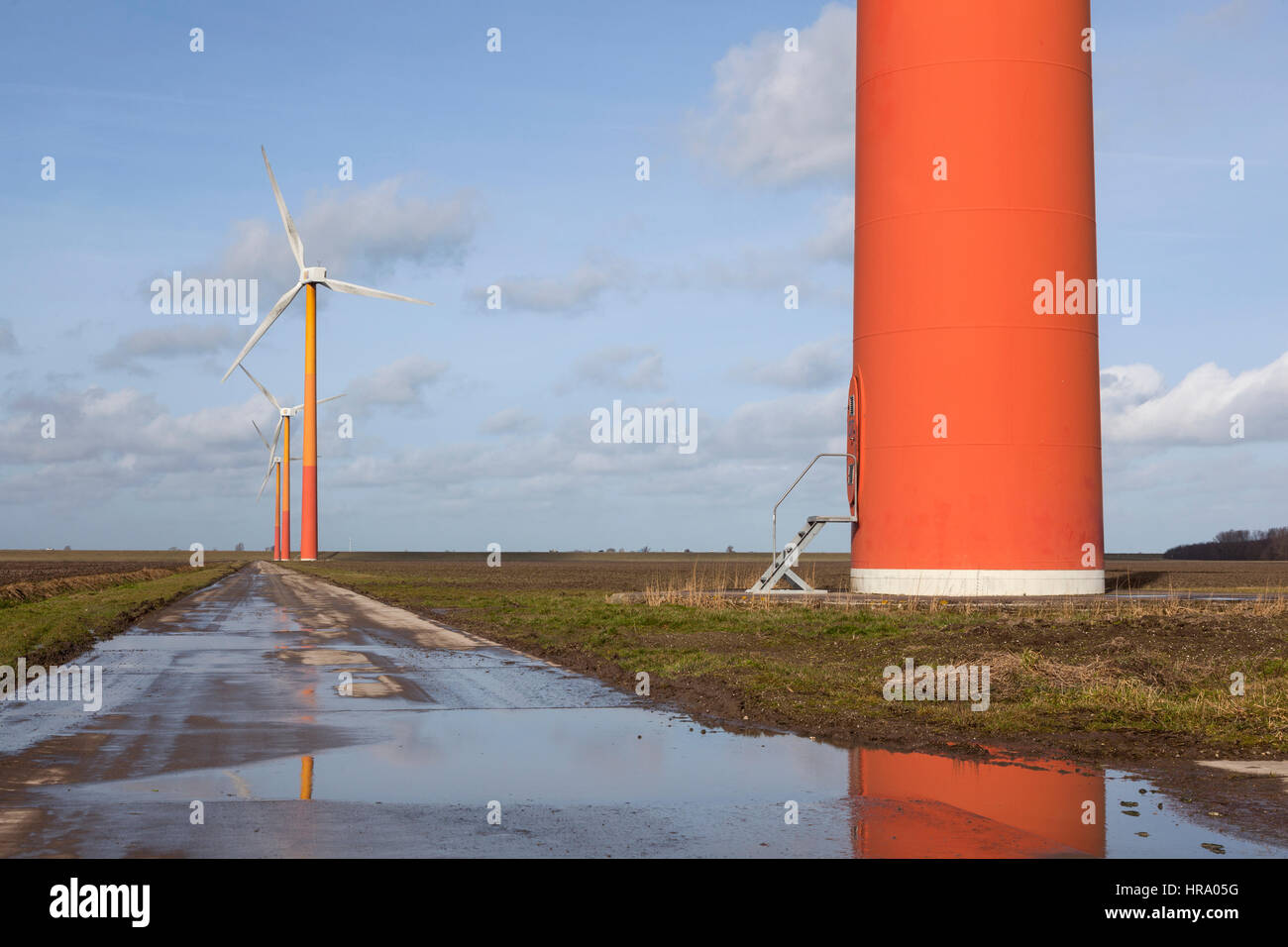 orange wind turbines in the netherlands on the island of flevoland near ...