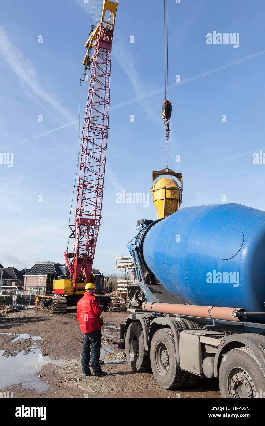 cement truck unloading on constyruction site and blue sky Stock Photo ...