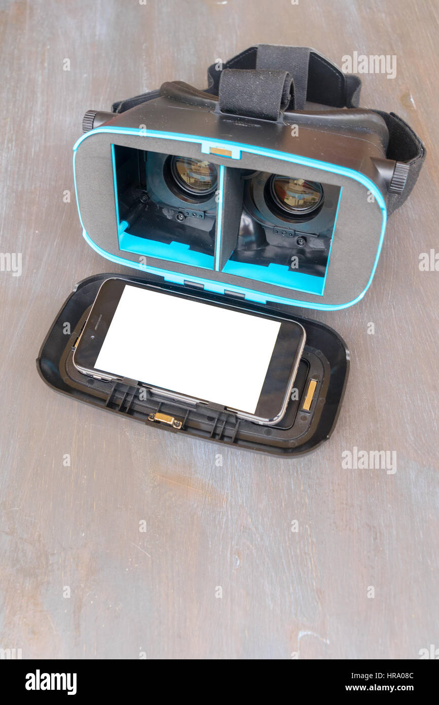 Virtual reality glasses - open one and phone with blank screen inside ...