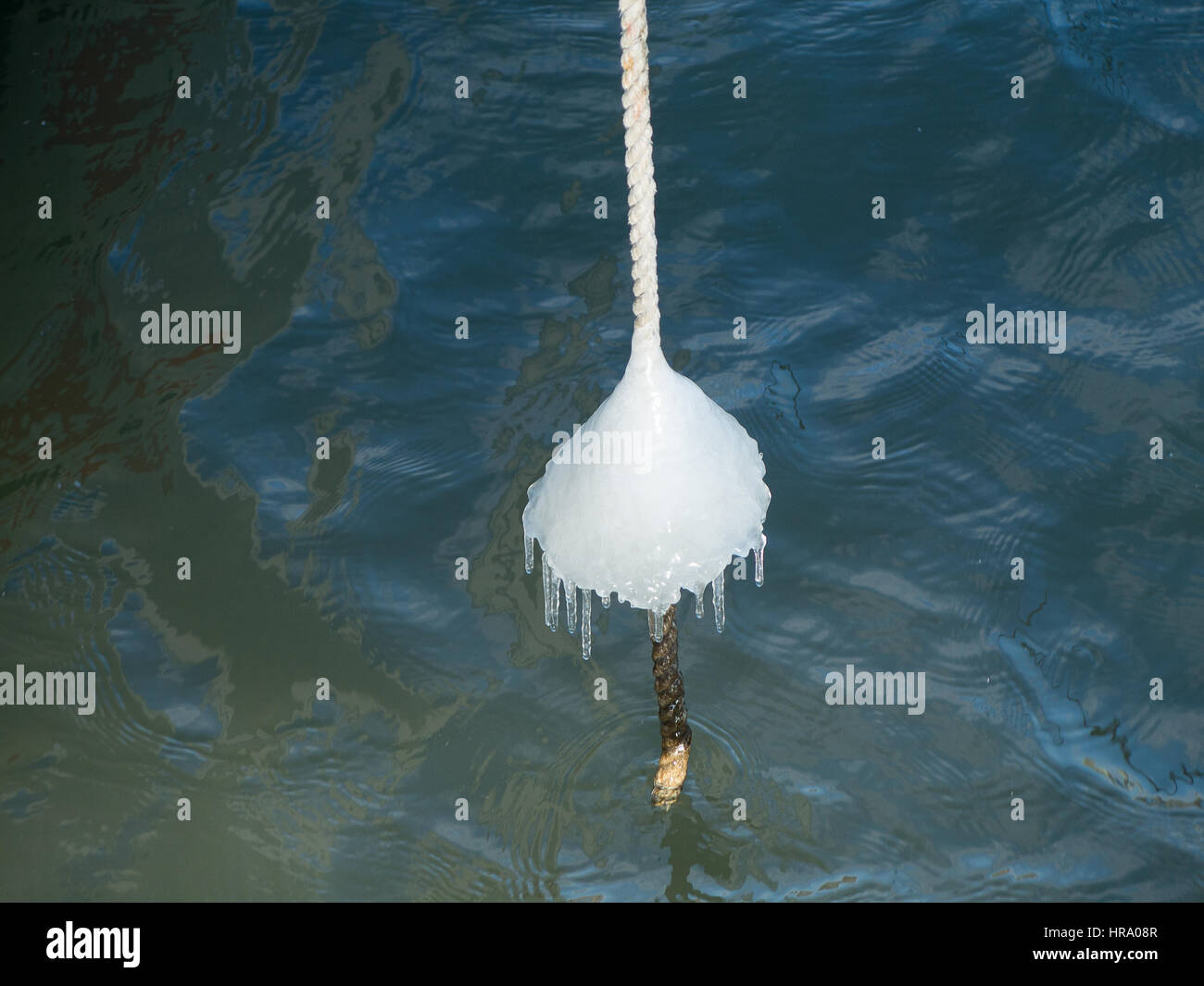some rope from a boat with ice on and it is frozen Stock Photo - Alamy