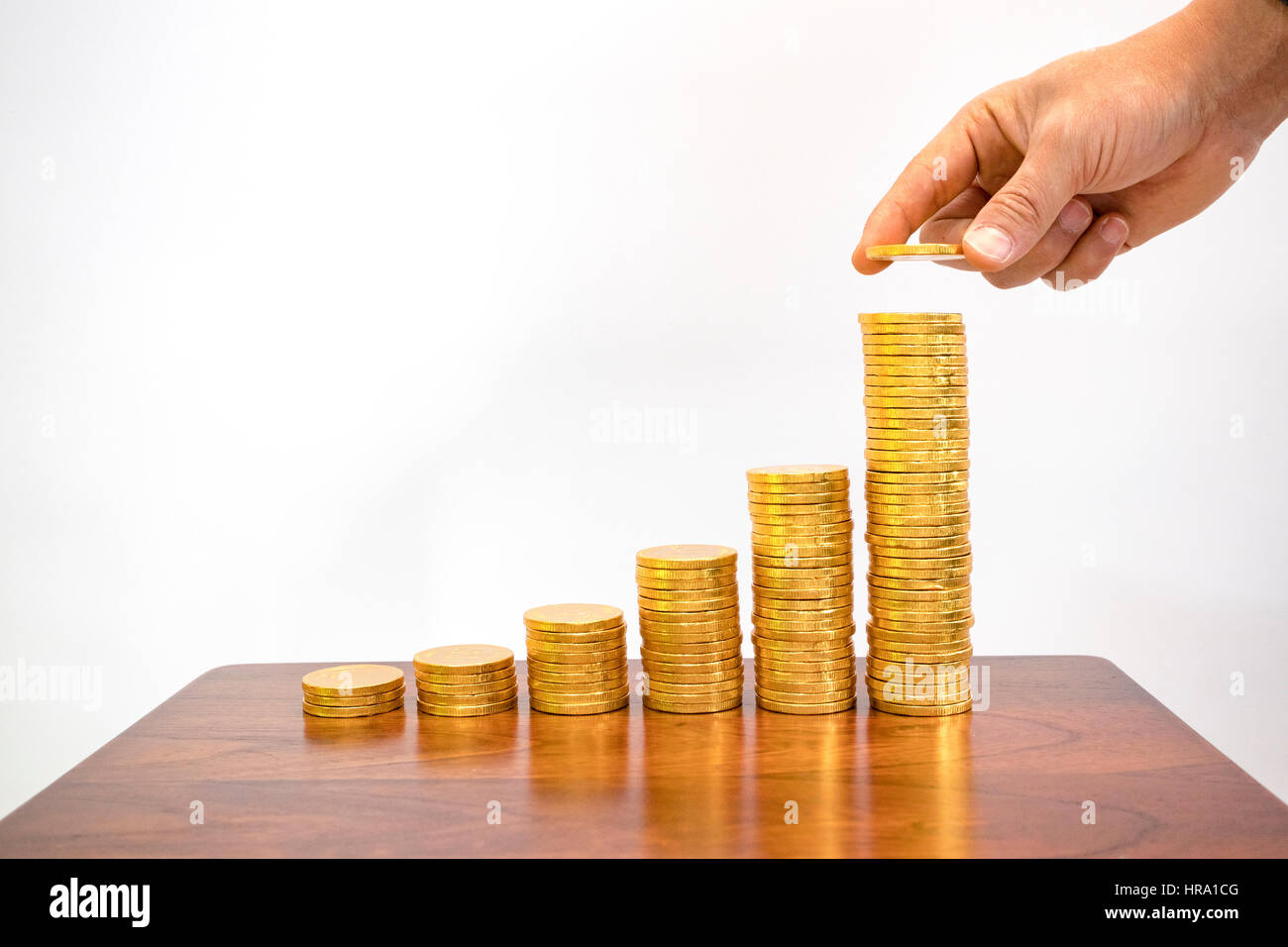 Stacking coin growing gold hi-res stock photography and images - Alamy