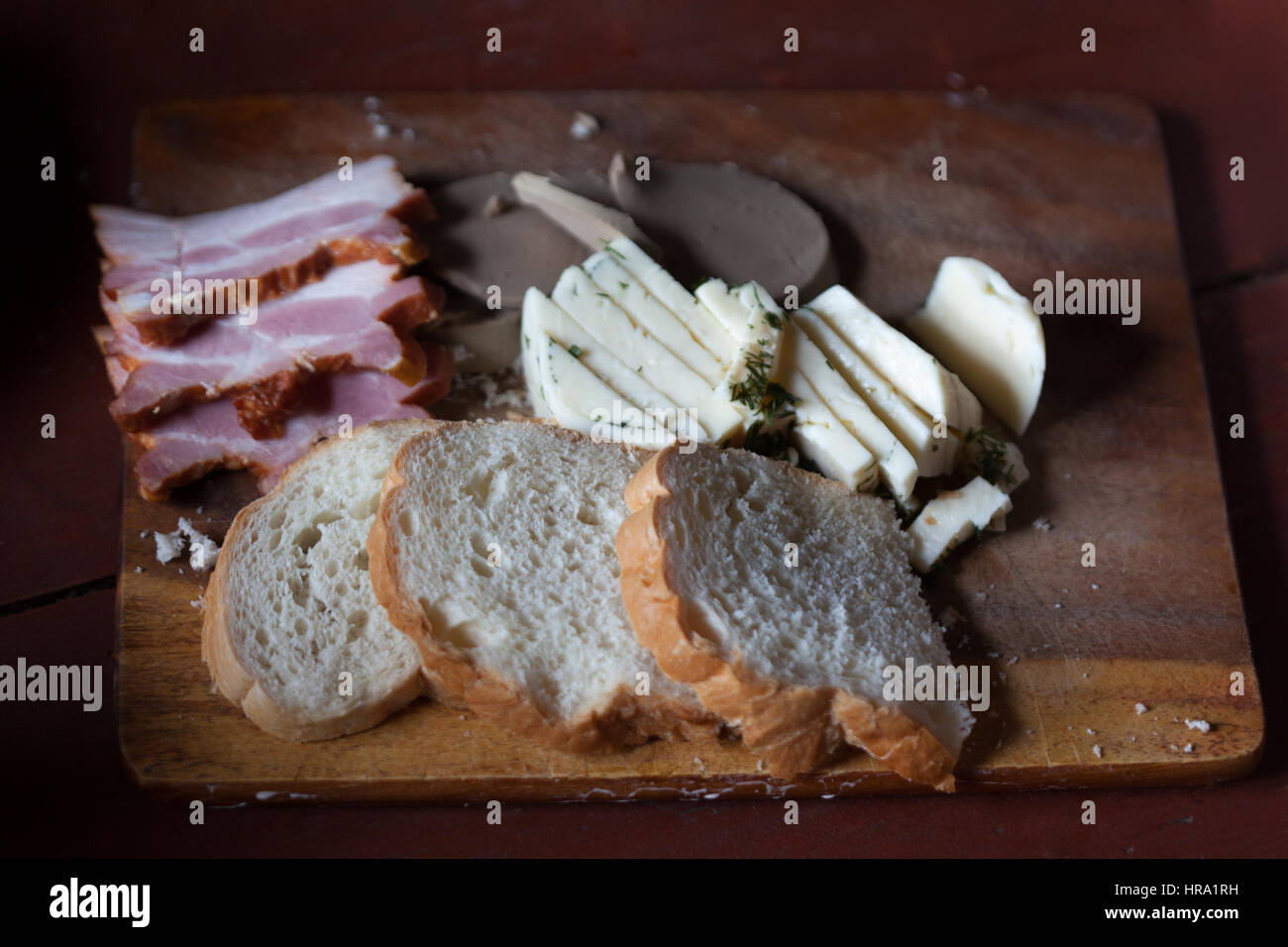 bread meat and cheese on old cutting Board Stock Photo - Alamy