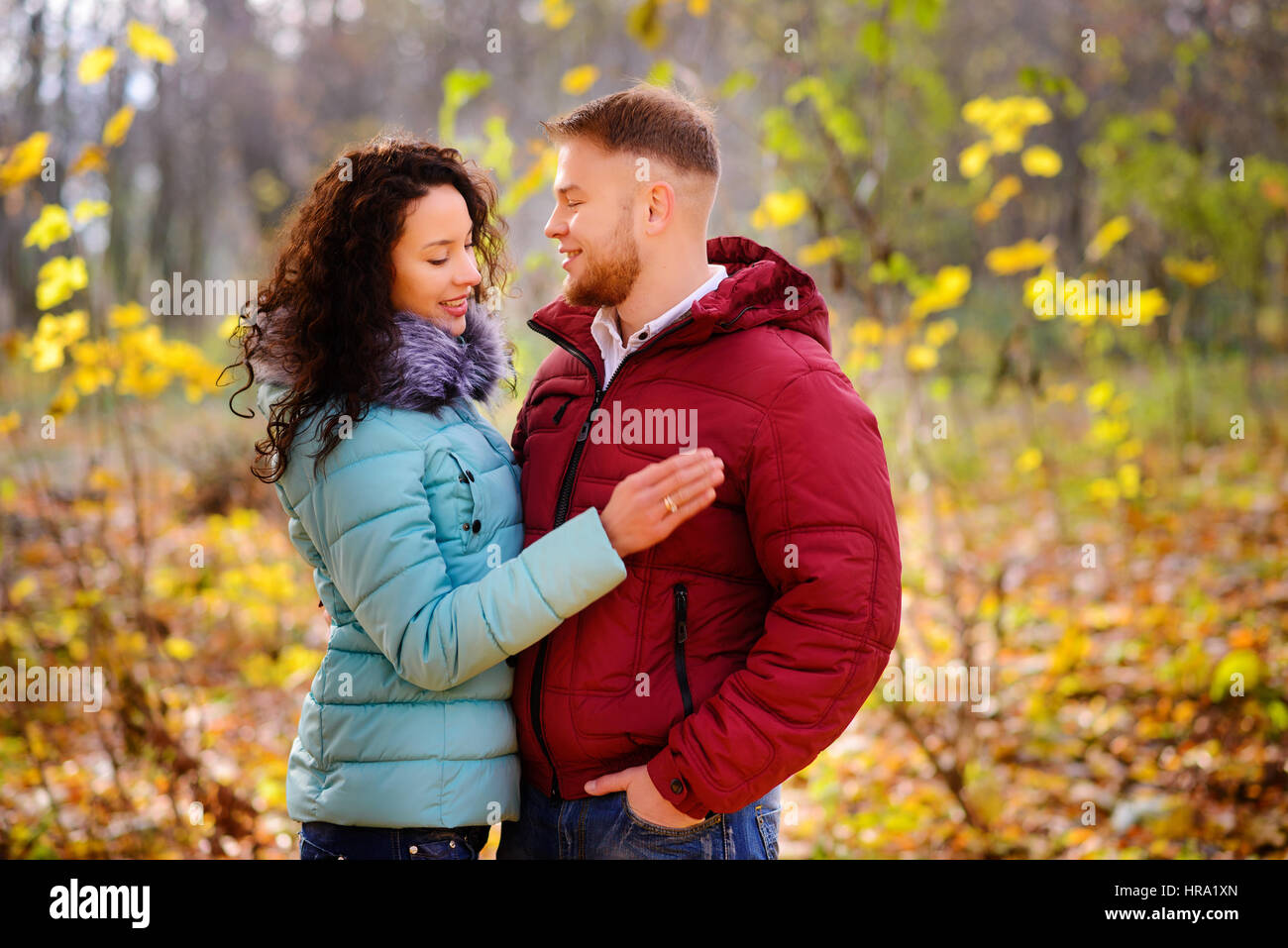 Lovers walking hand in hand in autumn park Stock Photo - Alamy