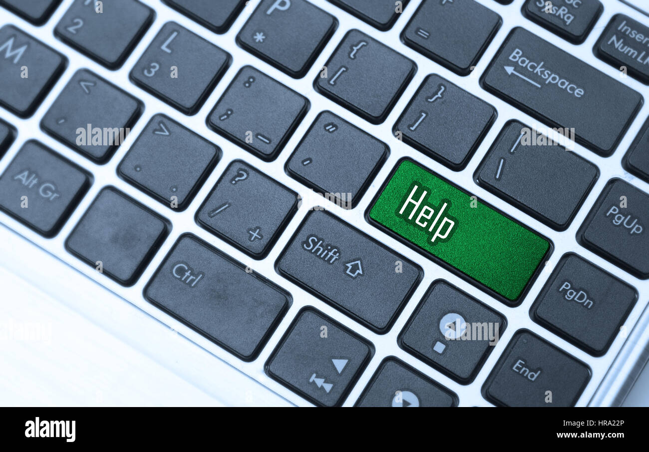 Keyboard with green key button - Help Stock Photo - Alamy