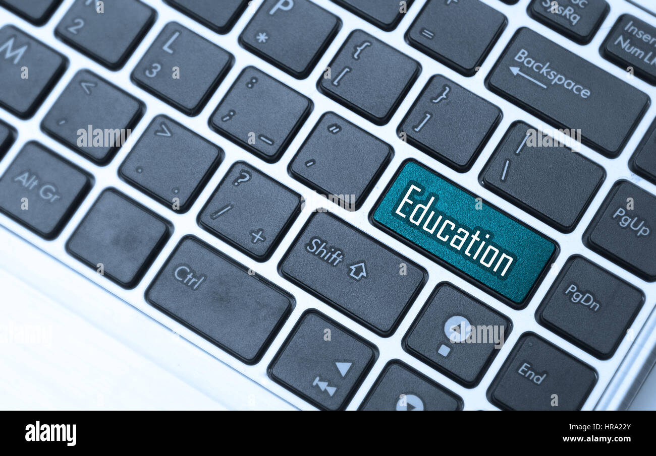 Keyboard with blue key button - Education Stock Photo - Alamy
