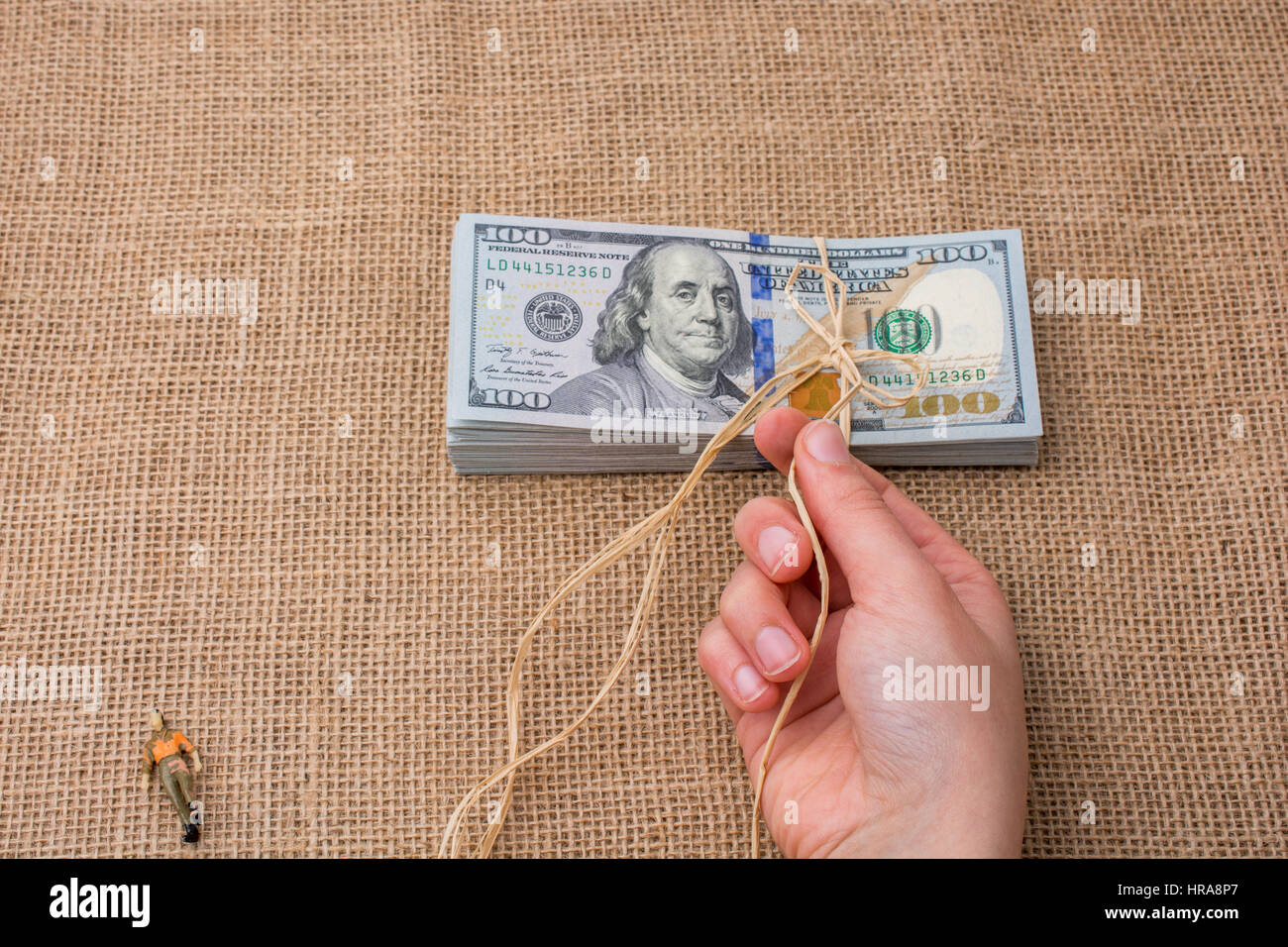 Banknote bundle of US dollar tied with colorful a ribbon Stock Photo ...