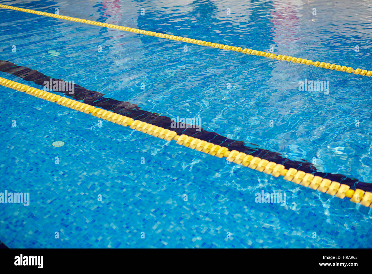 Background image of rippling clear blue water in swimming pool with ...