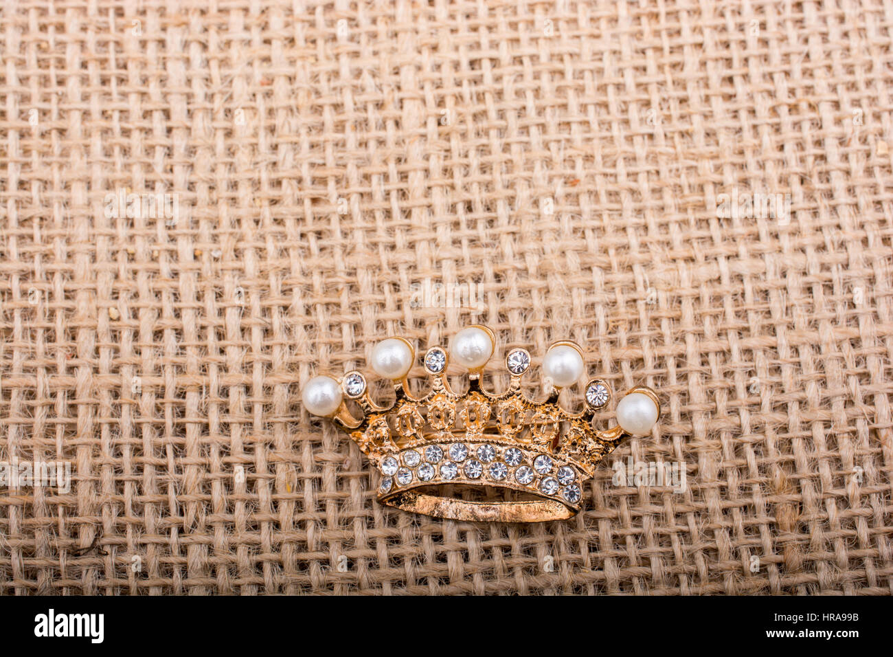 Little model crown placed on a linen canvas Stock Photo - Alamy