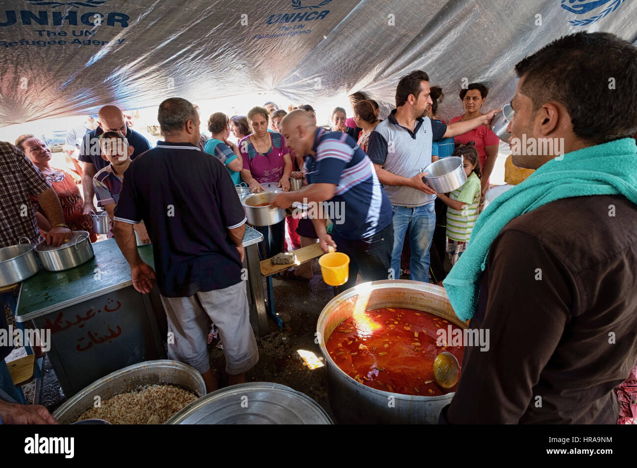 food being distributed to refugees who have fled isis find refuge in ...