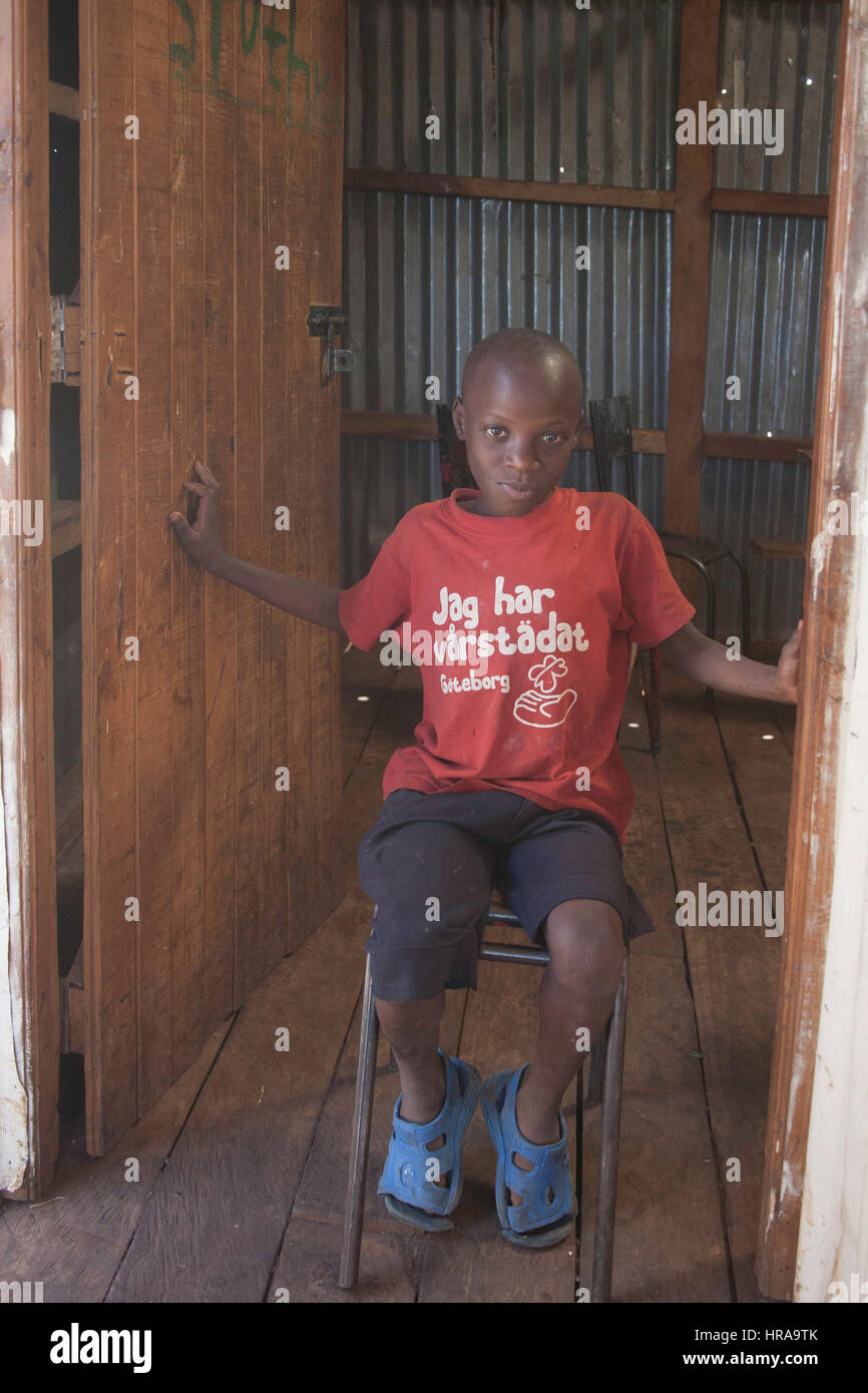 Portrait of a young boy in an orphanage in kibera slum, Nairobi, Kenya ...