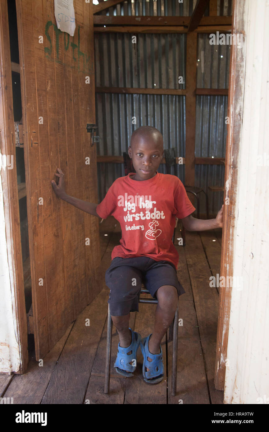 Portrait of a young boy in an orphanage in kibera slum, Nairobi, Kenya ...