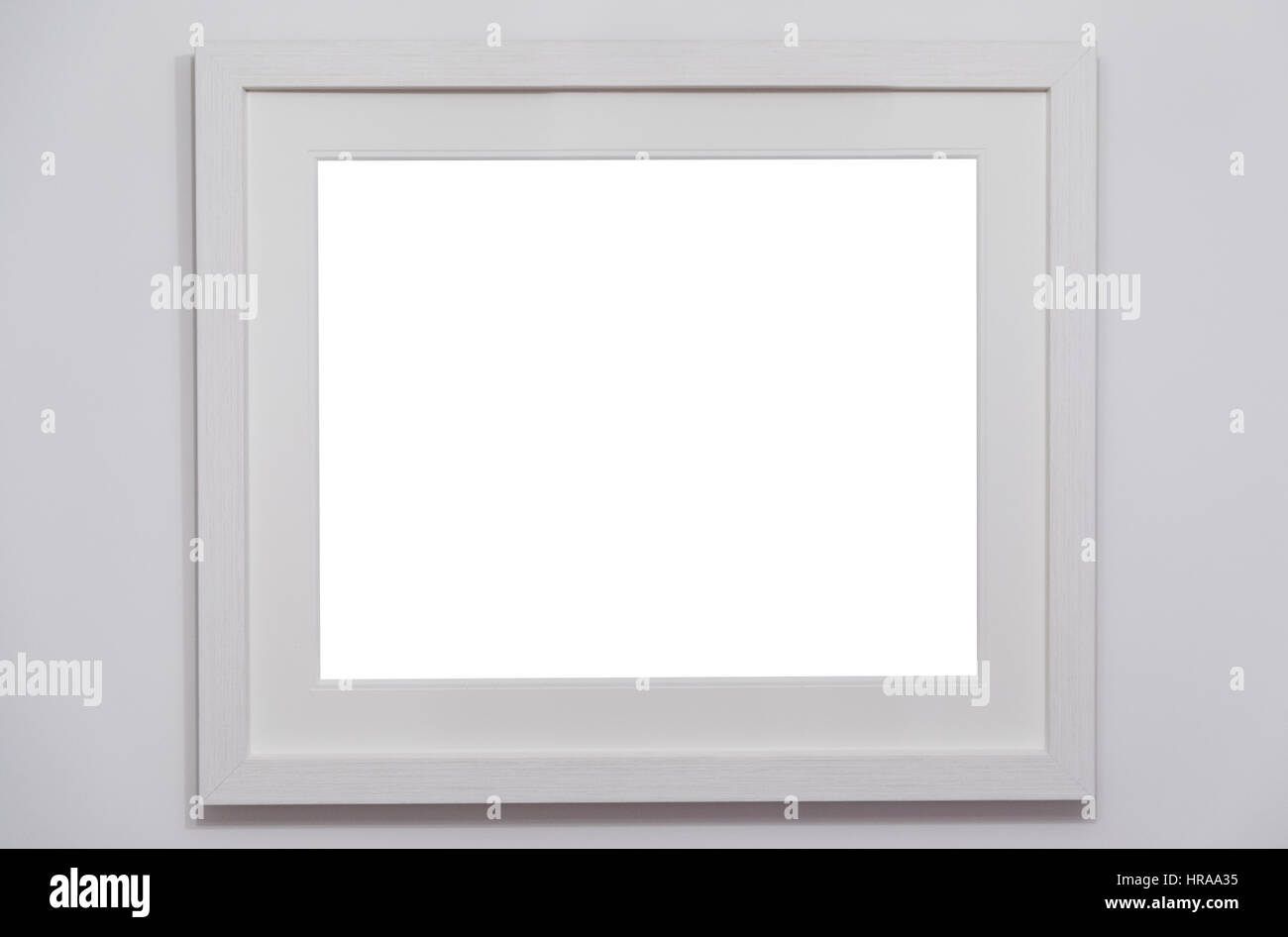 White wooden picture frame on a wall Stock Photo - Alamy