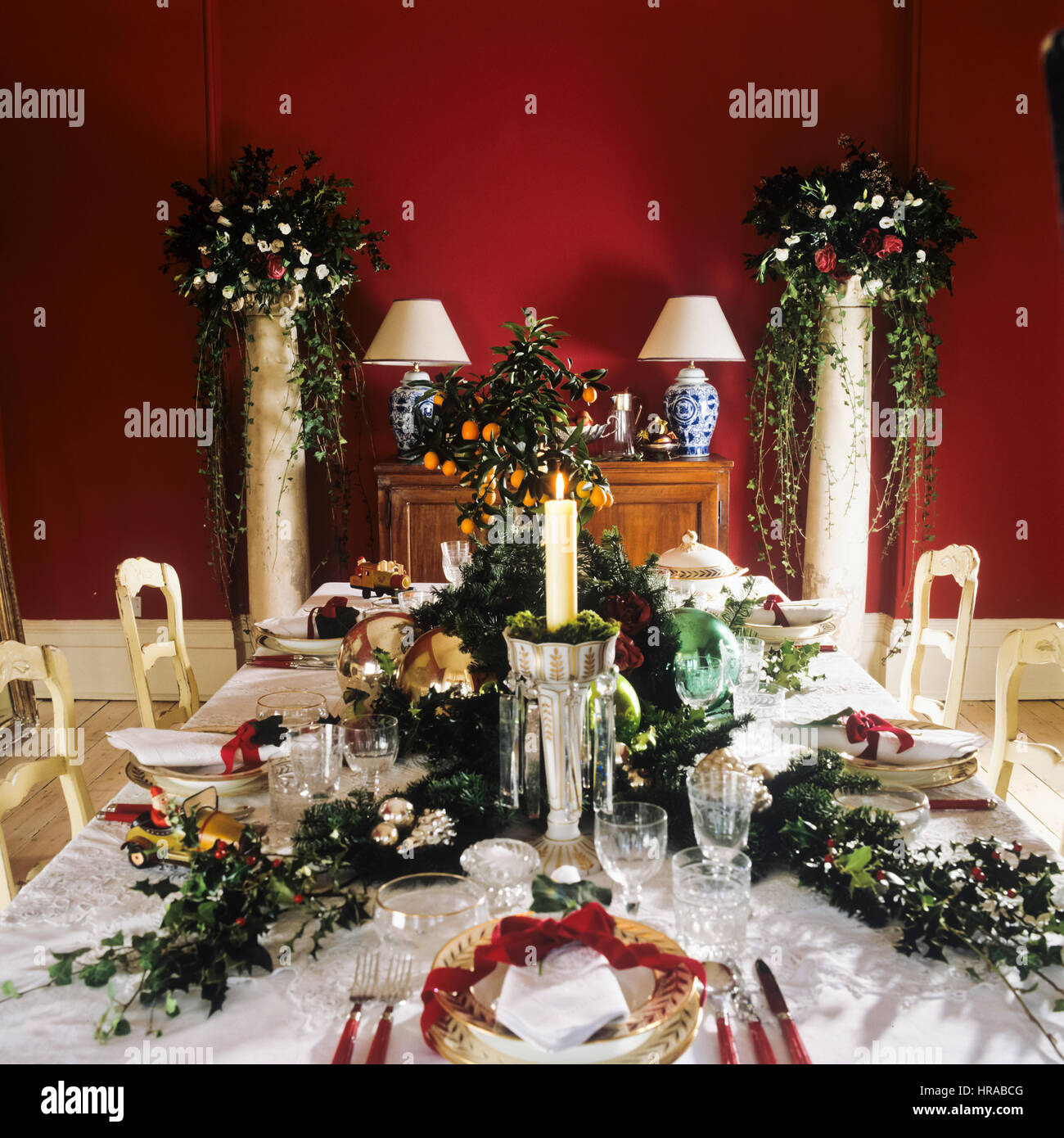 A dining room with garlands on pillars Stock Photo - Alamy
