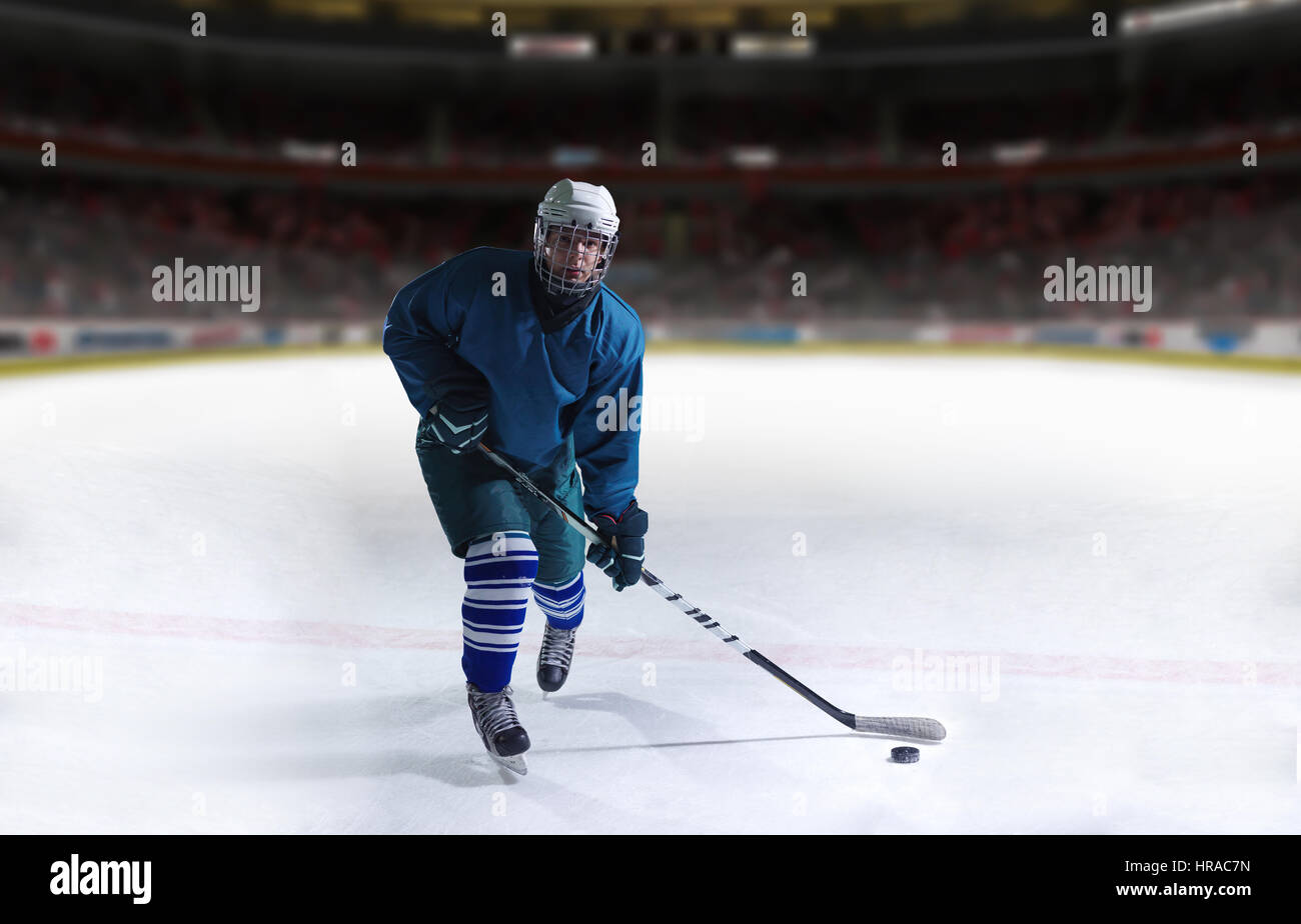 ice hockey player in action kicking with stick Stock Photo - Alamy