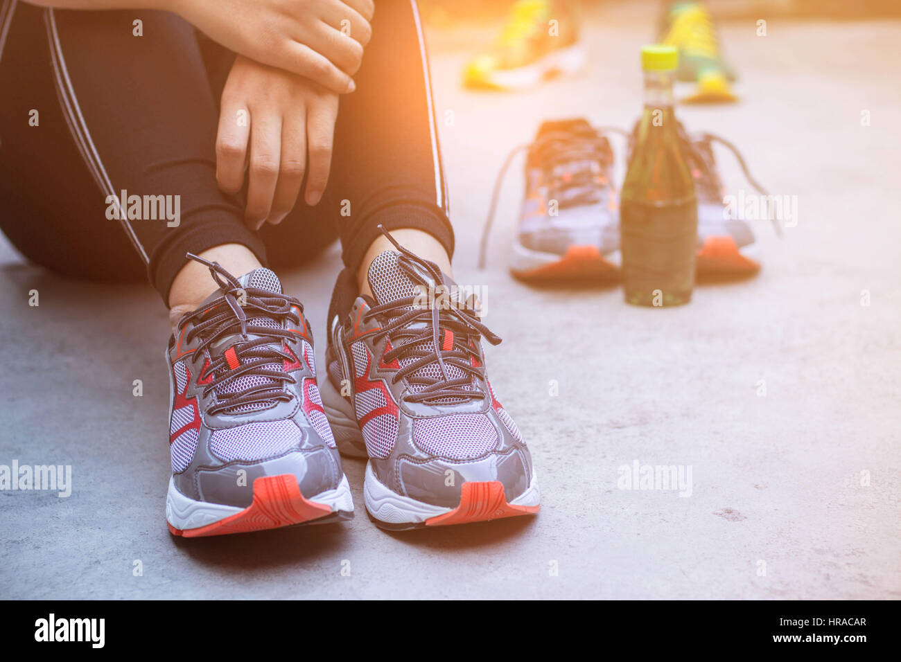 Women athletes are resting after jogging Stock Photo - Alamy