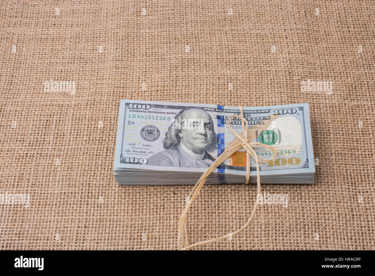 Banknote bundle of US dollar tied with colorful a ribbon Stock Photo ...