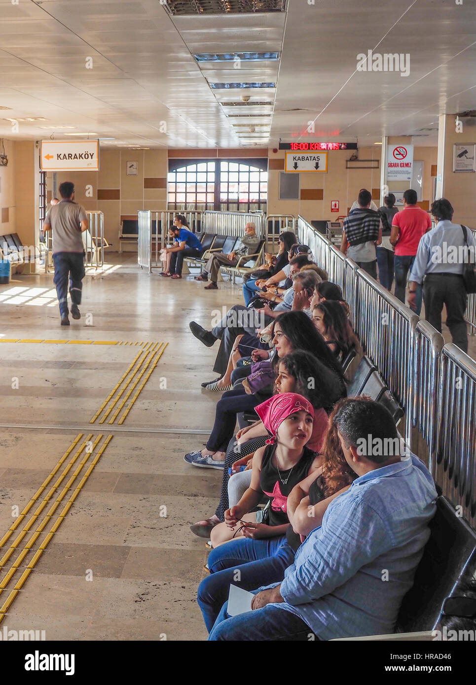 PASSENGERS WAITING AT TERMINAL FOR NEXT FERRY TO DOCK, AT FERRY ...