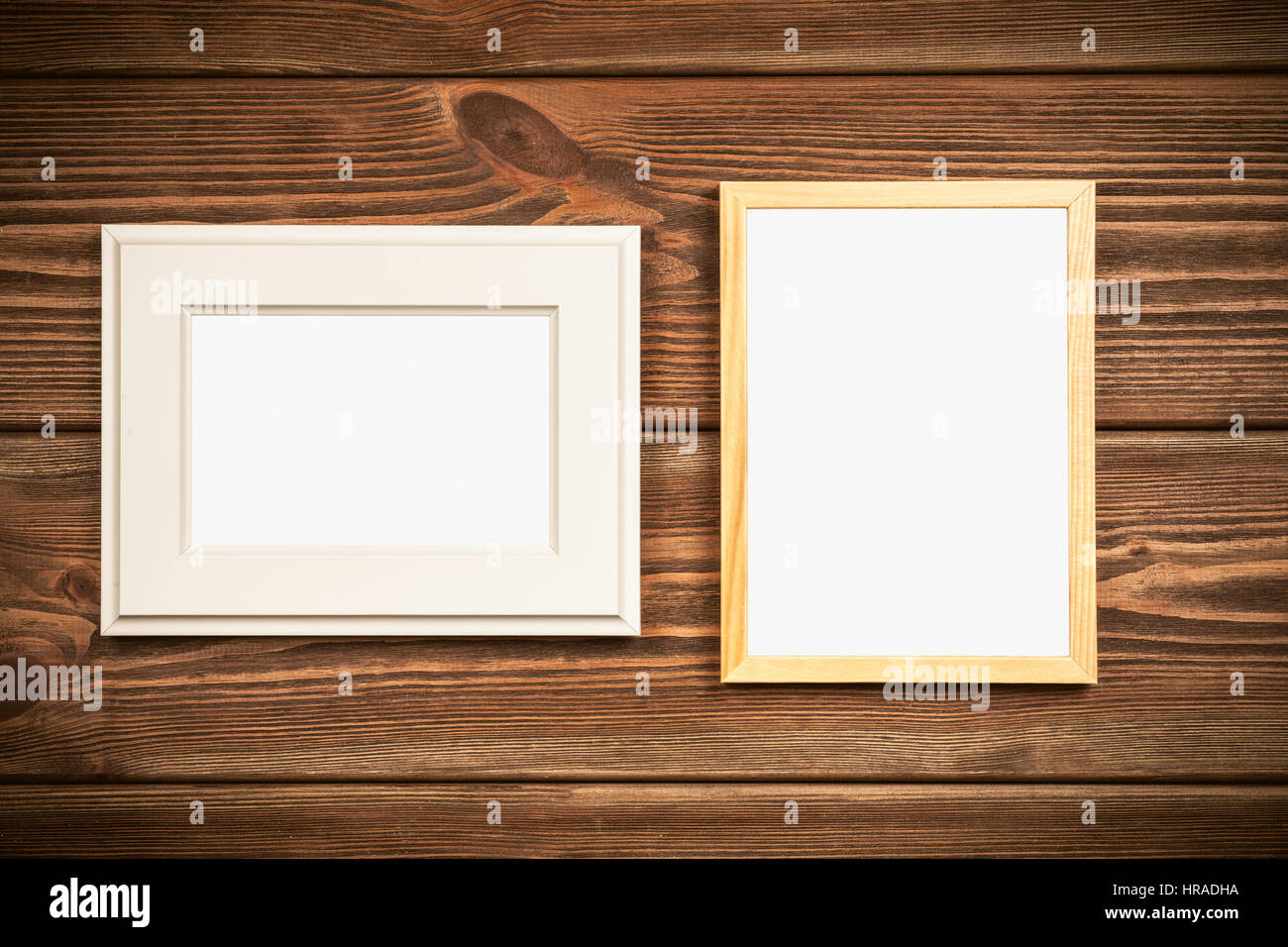 Picture frame on a wooden wall Stock Photo - Alamy