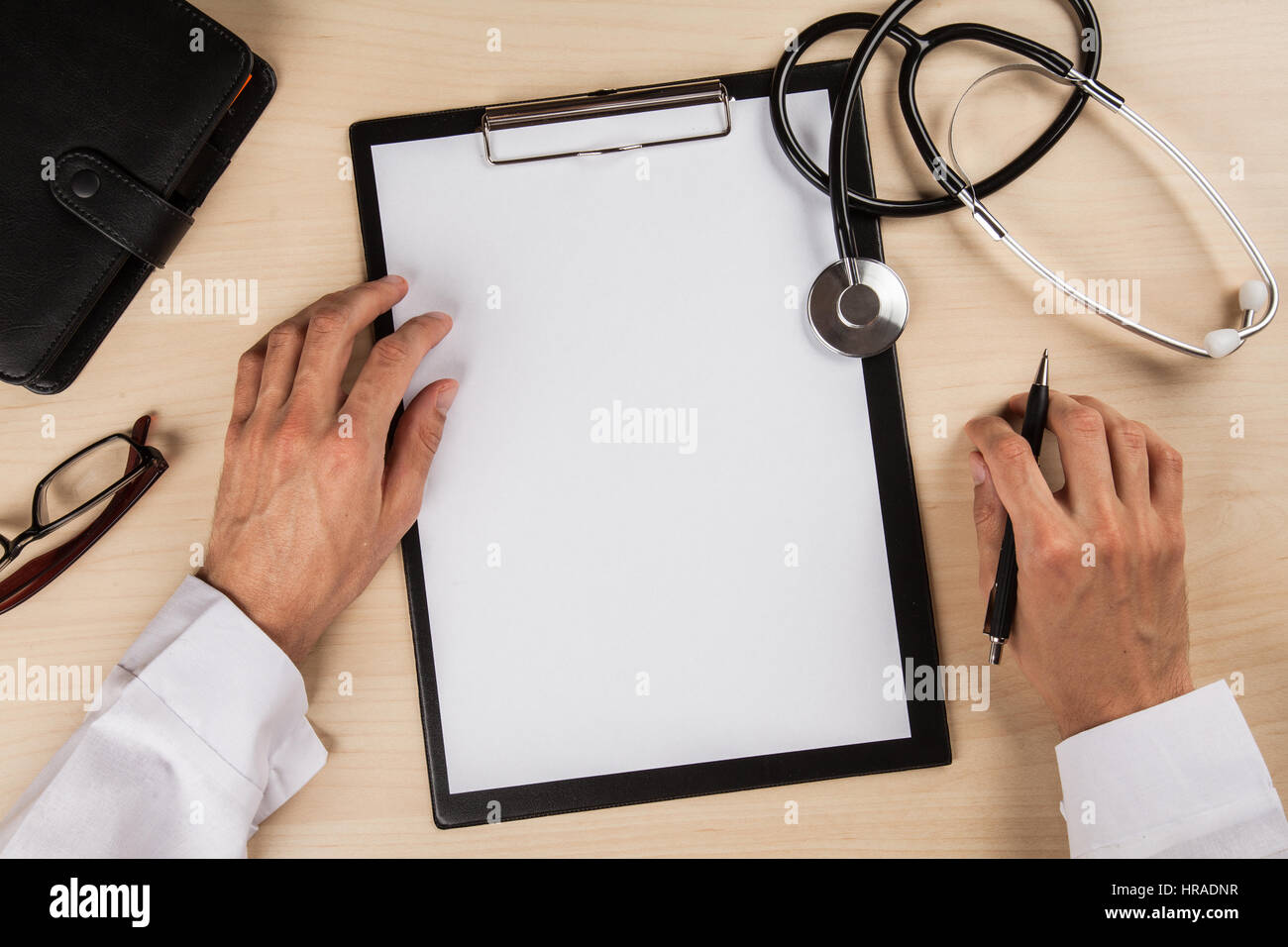 Doctor's working table Stock Photo - Alamy