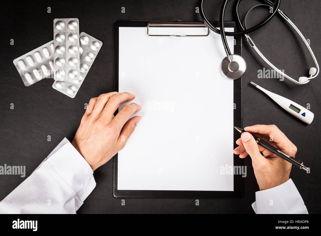 Doctor's working table Stock Photo - Alamy