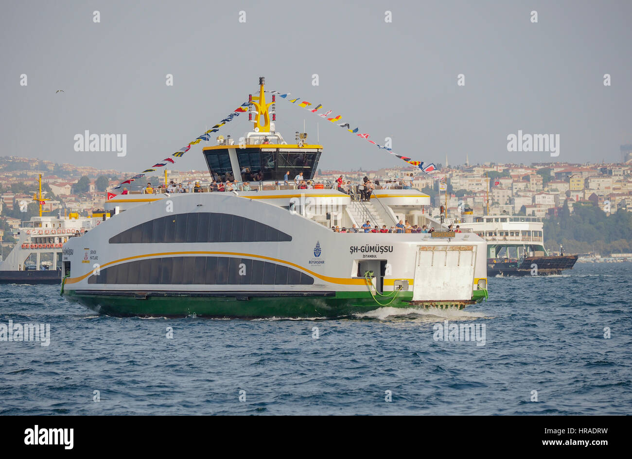 FERRY SHIP TRAVELLING FROM PORT TO PORT WITH TRAVELLERS AND VIEWS OF ...