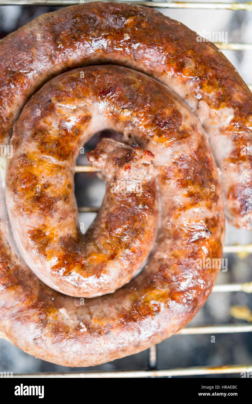 Boerewors cooking on a barai in Zimbabwe Stock Photo - Alamy