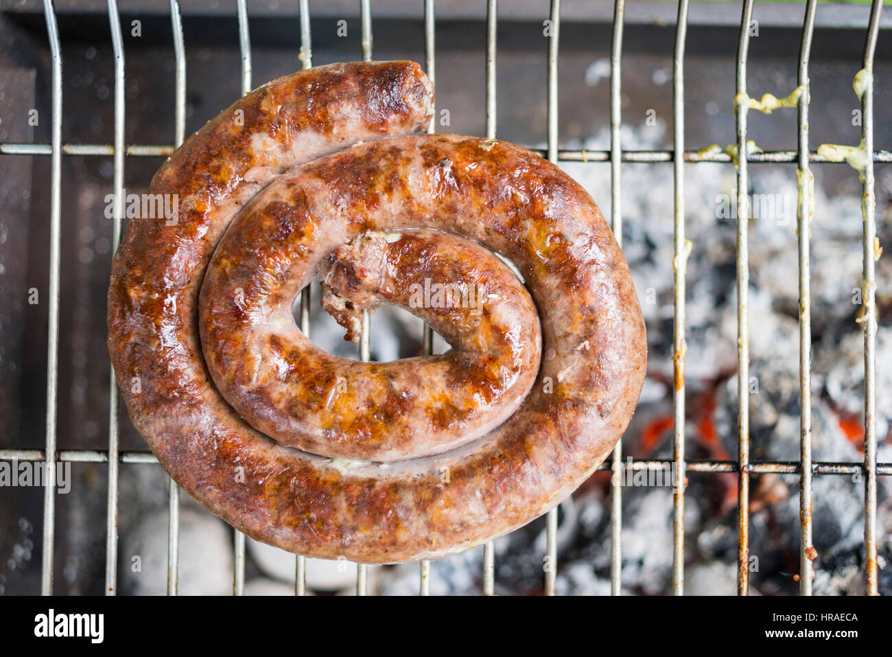 Boerewors cooking on a barai in Zimbabwe Stock Photo - Alamy