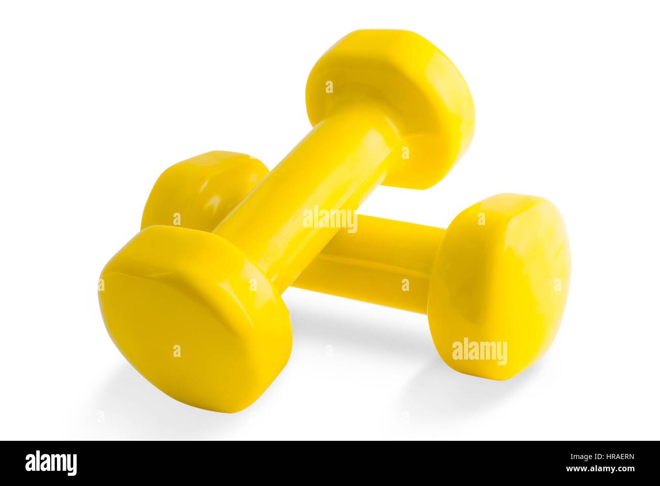 Two of yellow dumbbells, Isolated on white background Stock Photo - Alamy