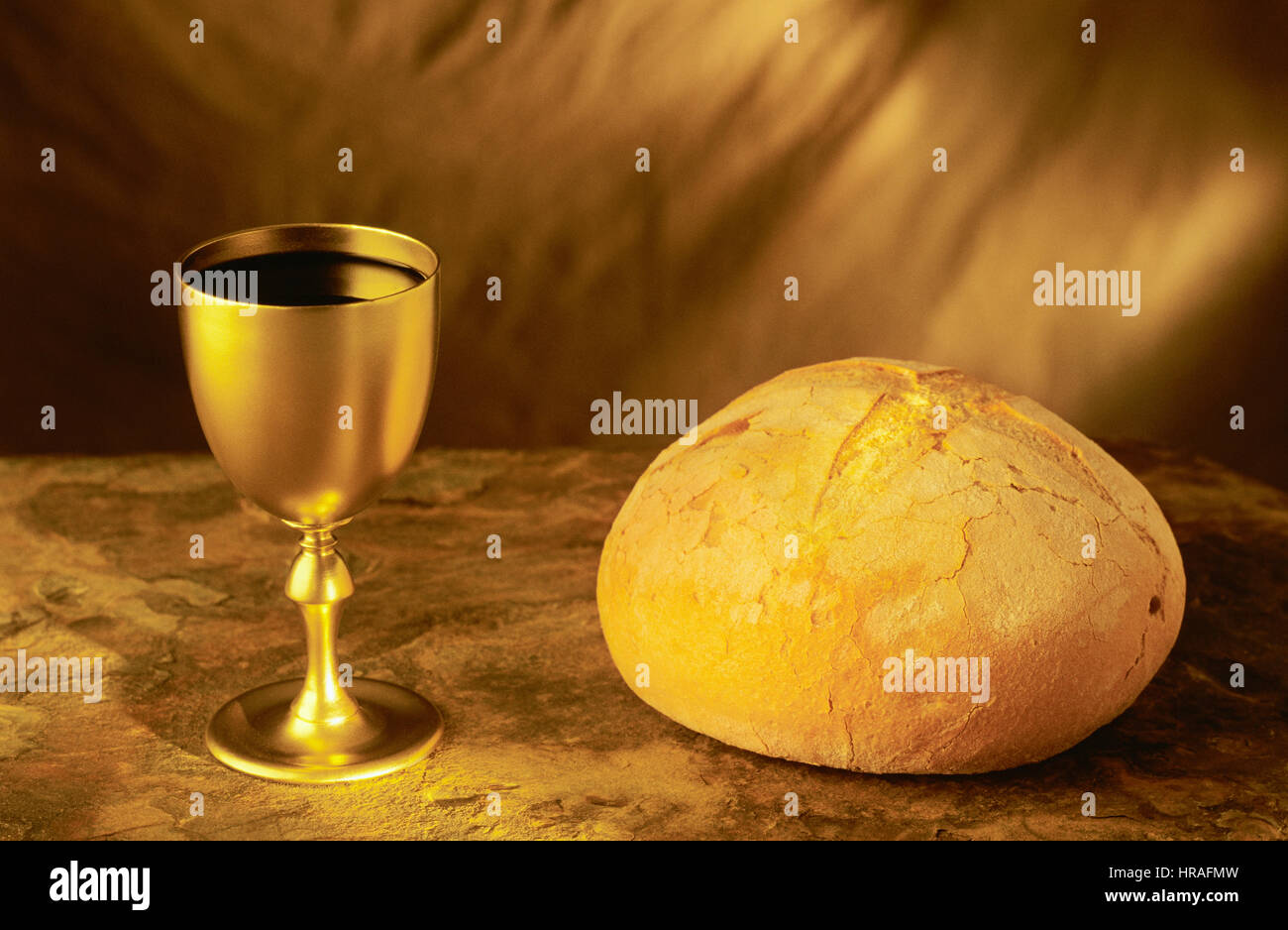 Wine Goblet and Broken Bread, Symbols of Communion Stock Photo - Alamy