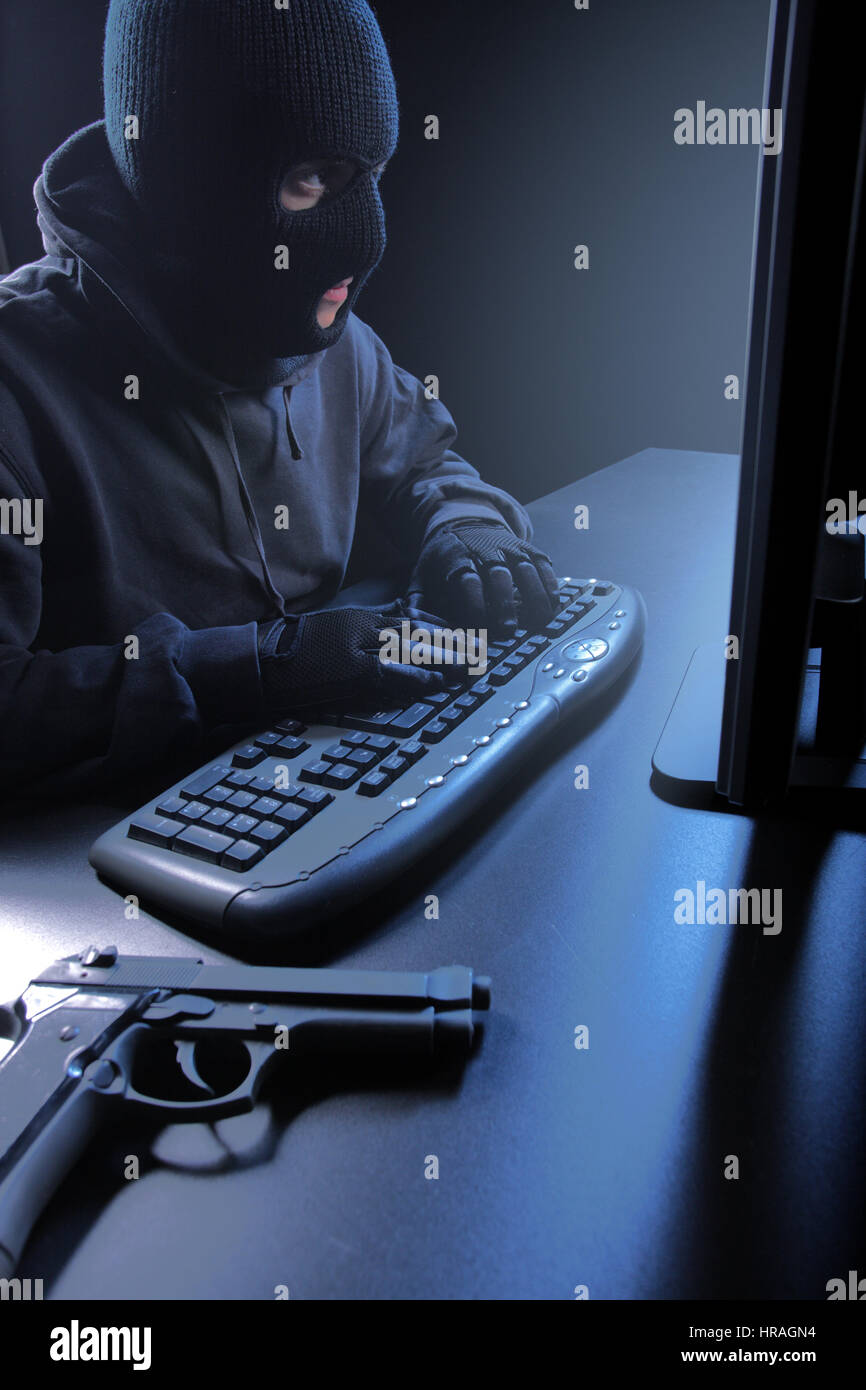Computer hacker - Male thief stealing data from laptop Stock Photo - Alamy Computer hacker - Male thief stealing data from laptop Stock Photo - Alamy