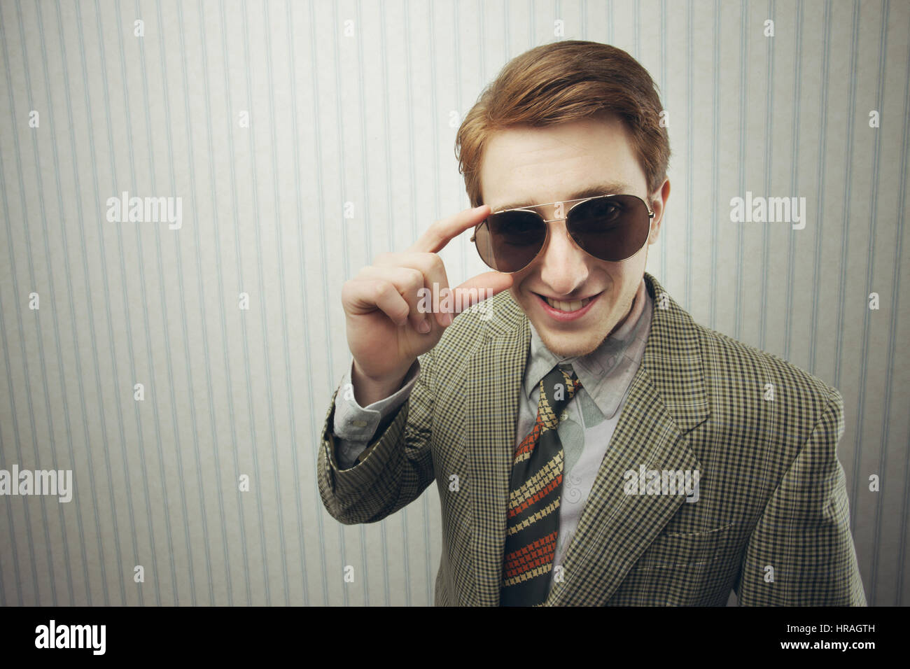 Sleazy Retro Businessman, on vintage wallpaper background Stock Photo ...