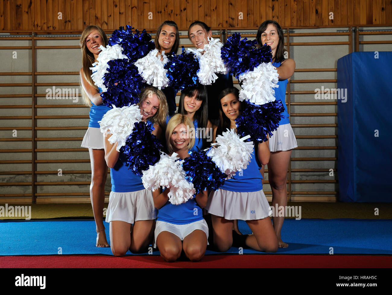 Young cheerleaders team training in the gym Stock Photo - Alamy