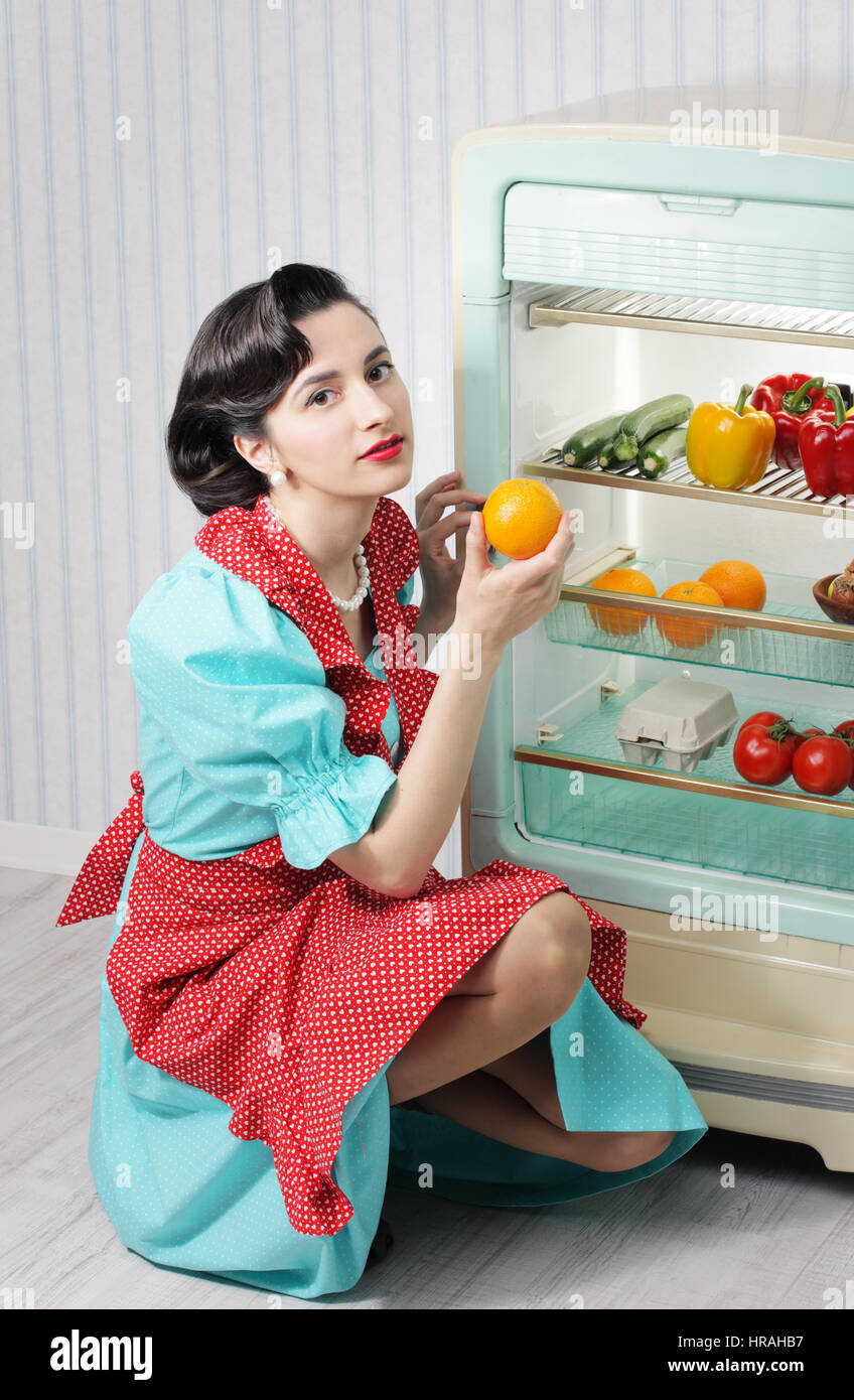 Beautiful woman posing with an open refrigerator Stock Photo - Alamy