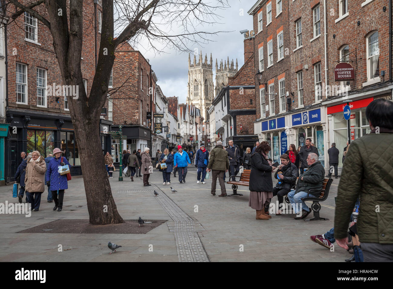 A view of the busy Low Petergate in York city center with the Minster ...