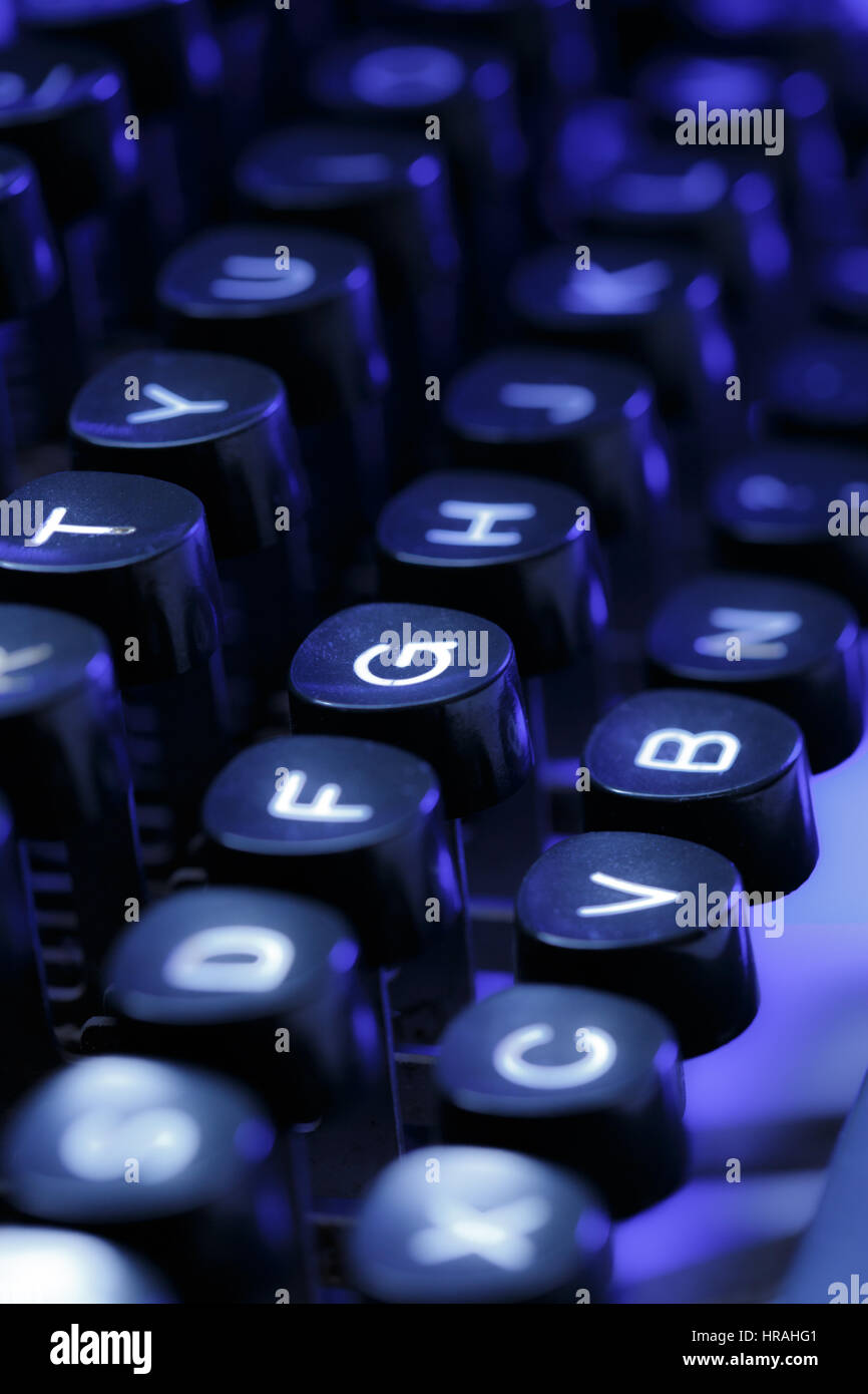 Keyboard of typewriter in blue toning Stock Photo - Alamy