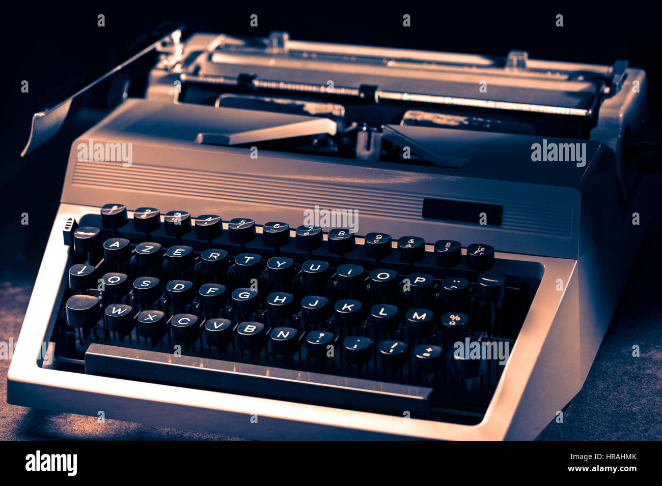 Old-fashioned typewriter with latin alphabet in toning Stock Photo - Alamy