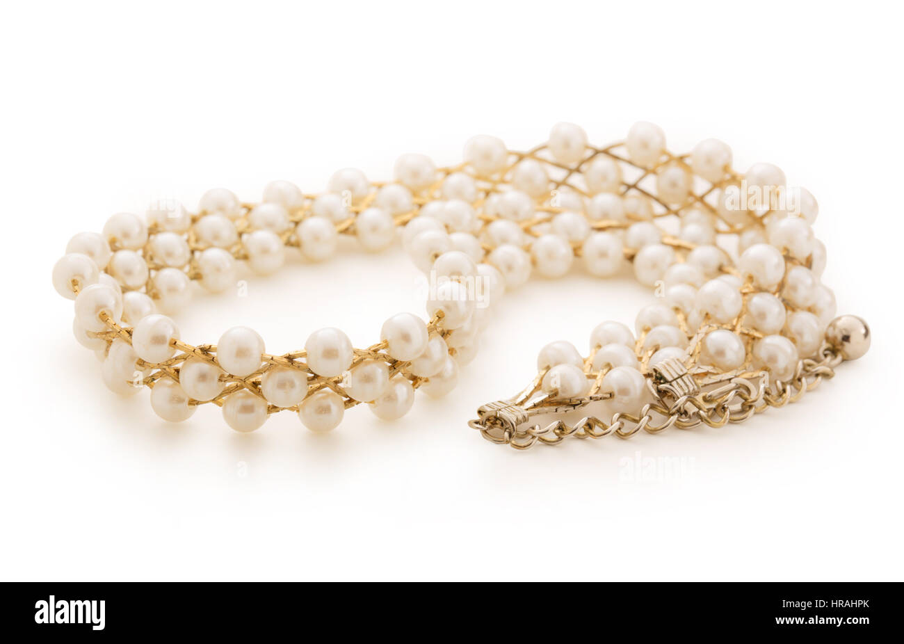 Necklace with golden chain and white beads Stock Photo - Alamy