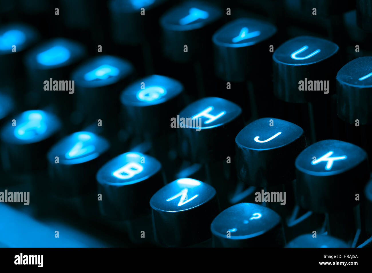 Keyboard of typewriter in blue toning Stock Photo - Alamy