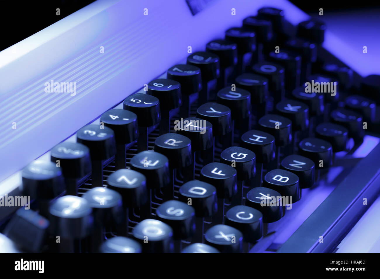 Keyboard of typewriter in blue toning Stock Photo - Alamy